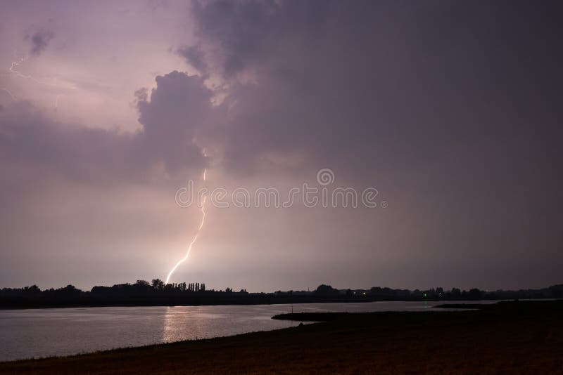 Dramatic River Landscape Image of Lightning Strike Near River Waal in ...