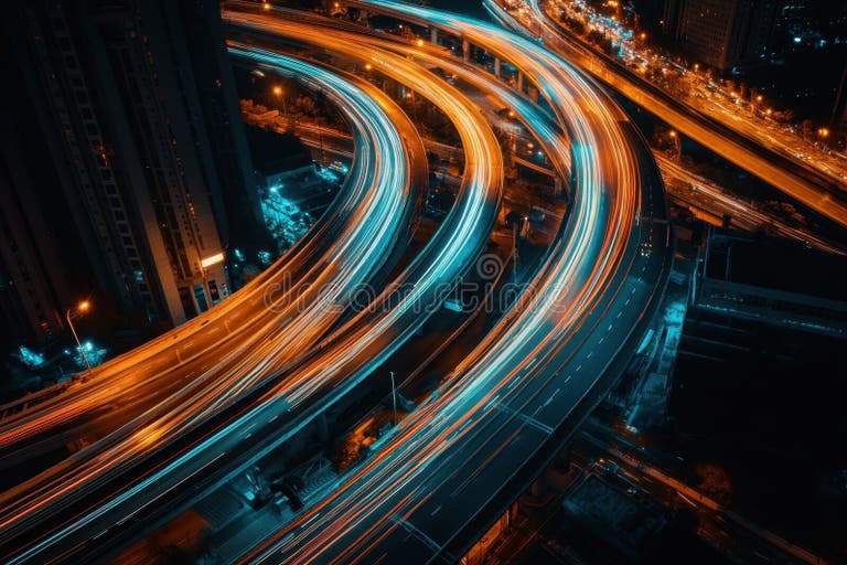 Urban Night View of Illuminated Highways Showcasing Moving Traffic in a ...