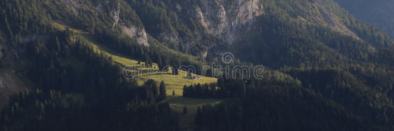 Bright Lit Farm in the Alps Stock Photo - Image of scenery, mountains ...