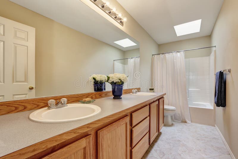 Bright Long Bathroom Interior with Large Double Vanity Unit. Stock ...