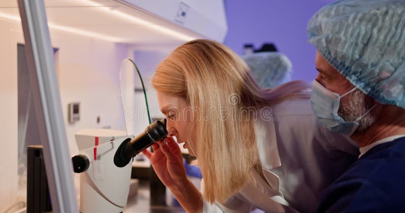 In Bright Medical Science Laboratory: Beautiful Microbiologist Wearing ...