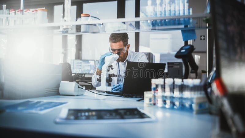 In Bright Medical Science Laboratory: Brilliant Microbiologist Looks ...