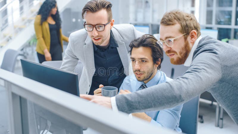 In Bright Modern Office: Businessman Sitting and Working at His Desktop ...