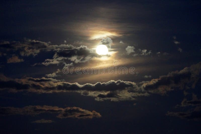 Bright Moon Behind the Clouds in the Dark Night Sky Stock Photo - Image ...