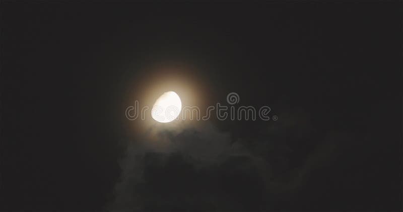 Bright Moon in the Night Sky Against the Background of Floating Clouds ...