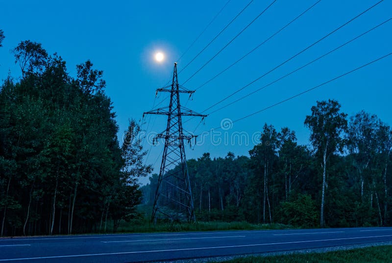 Bright Moon Over the High Voltage Transmission Line. Stock Photo ...