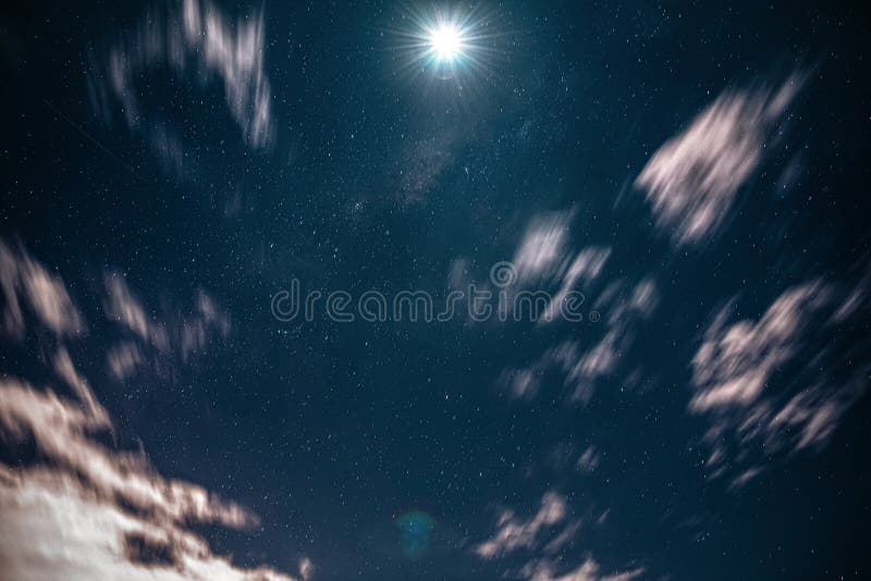 Bright Moonlight Illuminating a Starry Night Sky in Long Exposure Stock ...