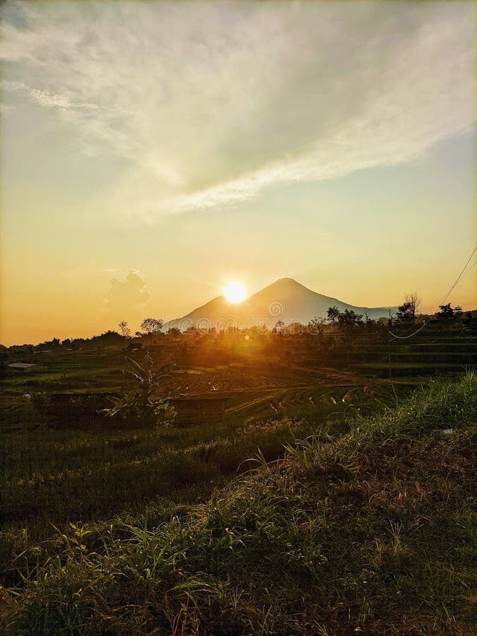 Bright Morning Sun between Mountains from Farmland View Stock Photo ...