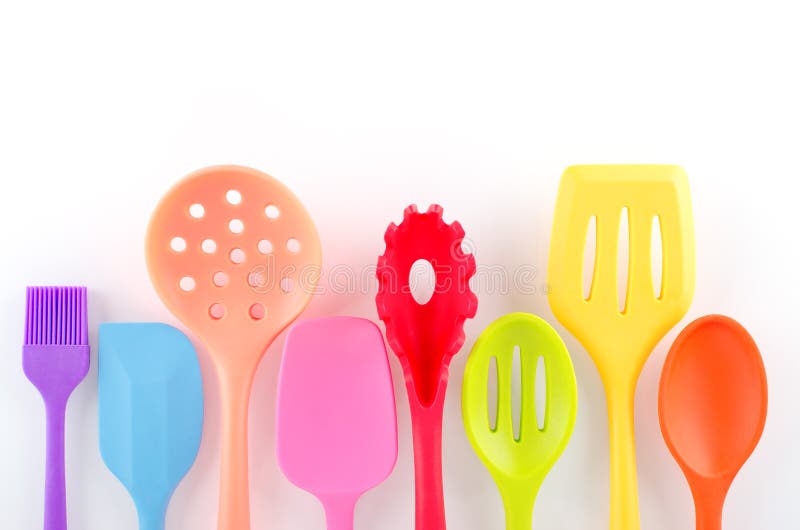 Bright Multi Colored Kitchen Utensils On White Background With Copy ...