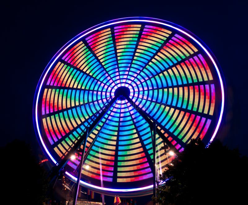 Bright Multi-Colored Spinning Ferris Wheel Stock Image - Image of ...