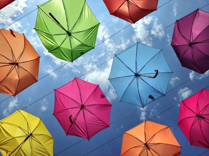 Bright Multi-colored Umbrellas in the Form of Decoration Against the ...