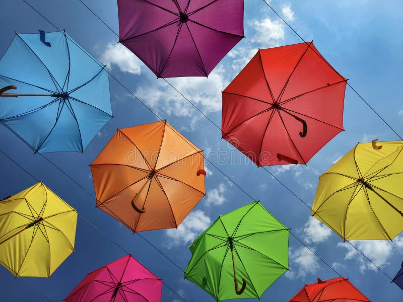 Bright Multi-colored Umbrellas in the Form of Decoration Against the ...