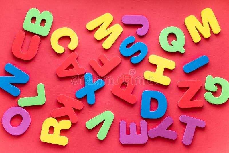 Bright Multicolored Alphabet Background. Multicolored Letters on Red ...