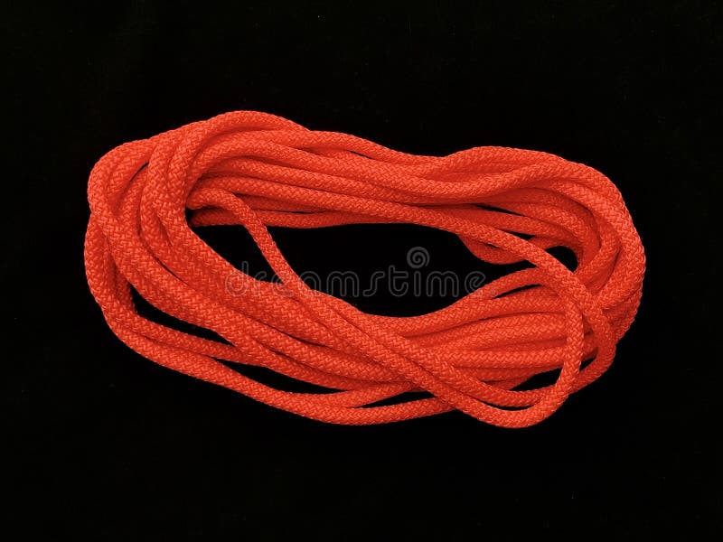 Bright Nylon Rope, on a Black Background. a Long Rope in a Bundle Stock ...