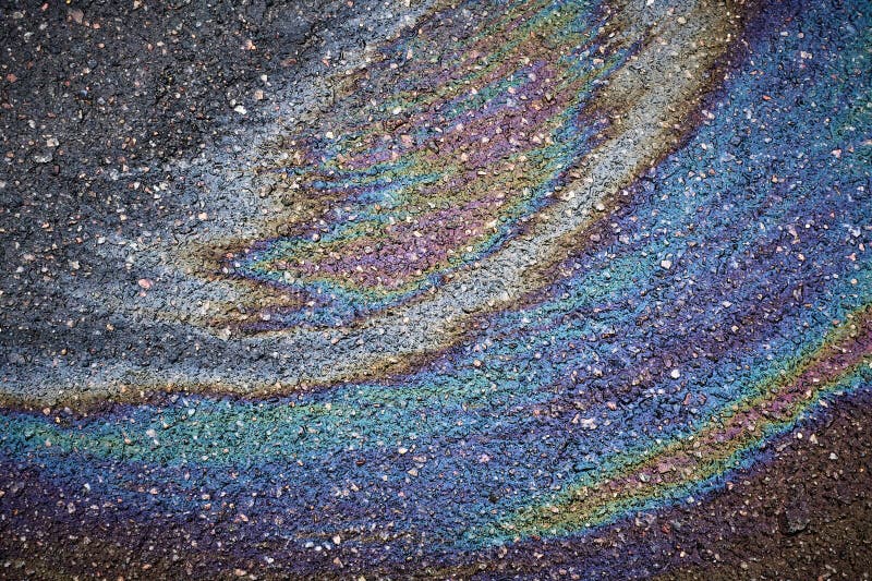 Bright Oil Stain Creating a Colorful Stain on Asphalt Stock Image ...