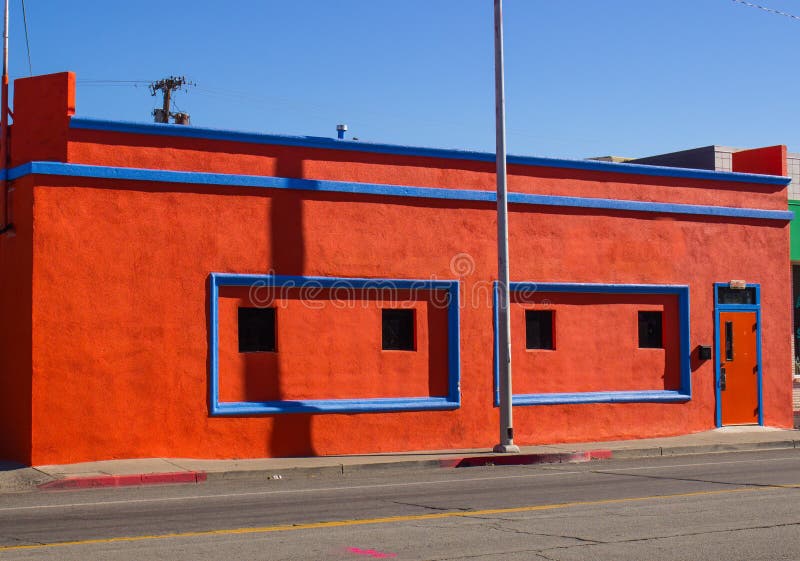 Bright Orange Building with Blue Trim Stock Image - Image of pole ...