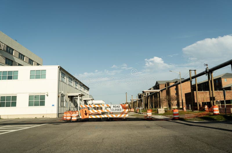 An Orange Construction Barricade is Sitting in the Middle of the Road ...