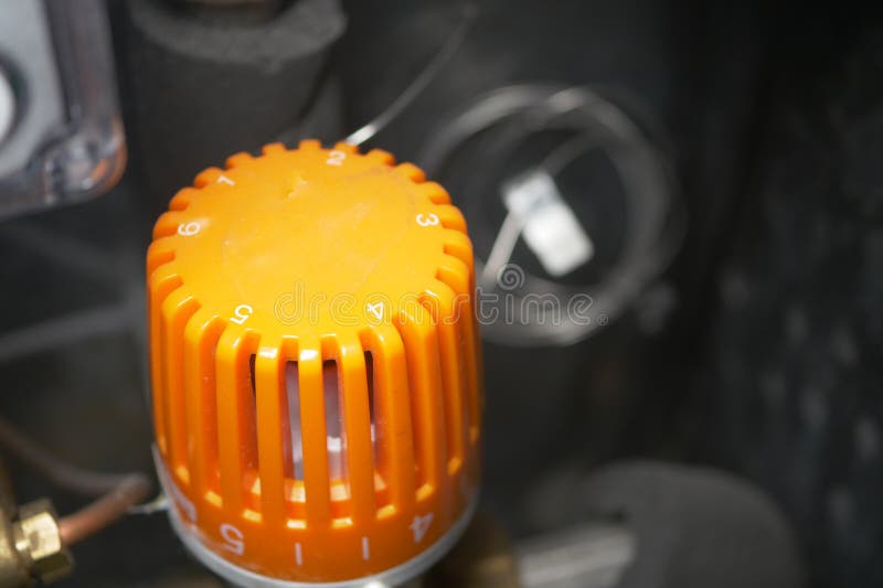 Bright Orange Dial on Mechanical Device in Workshop Setting Stock Image ...
