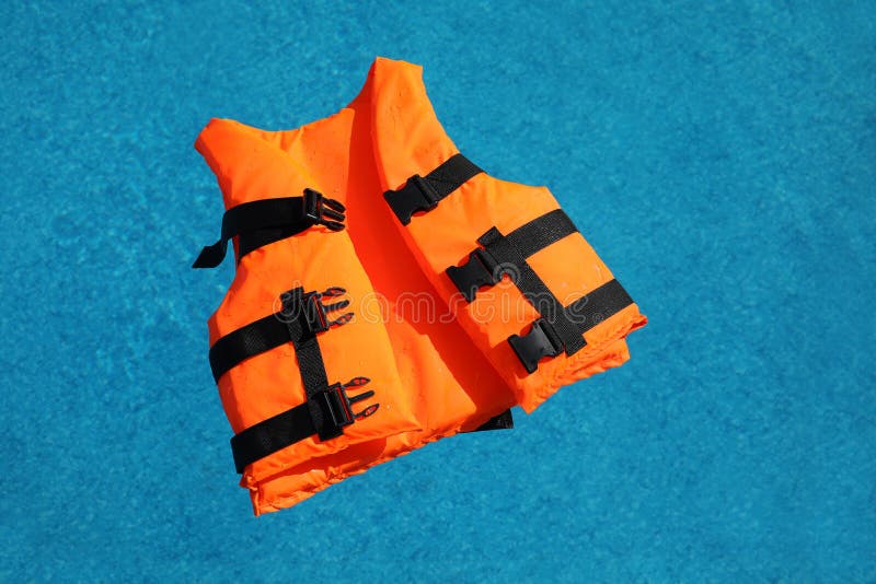 Bright Orange Life Jacket Floating in Swimming Pool, Top View Stock ...