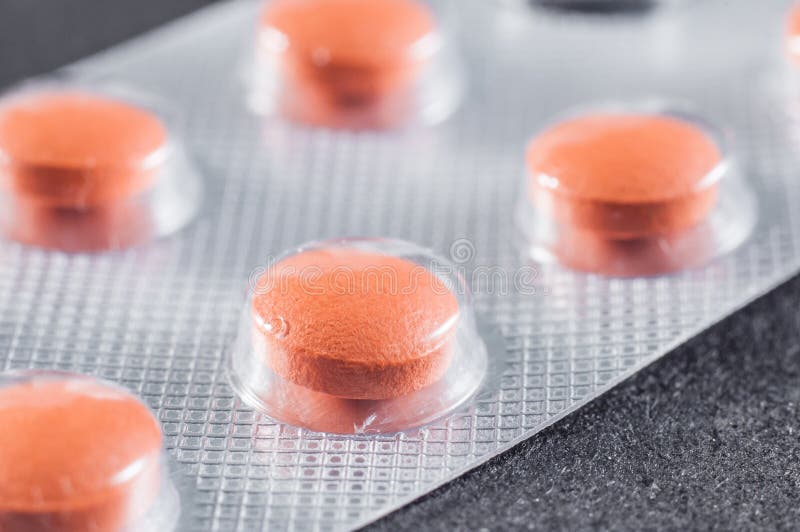 Orange pills close-up stock photo. Image of relief, medicine - 16876720