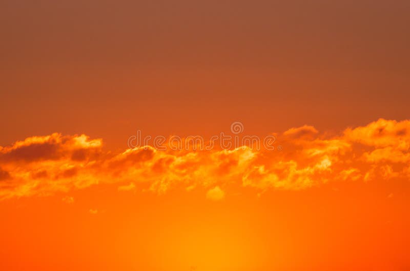 Bright Orange Red Sunset with an Even Layer of Cumulus Clouds. Stock ...