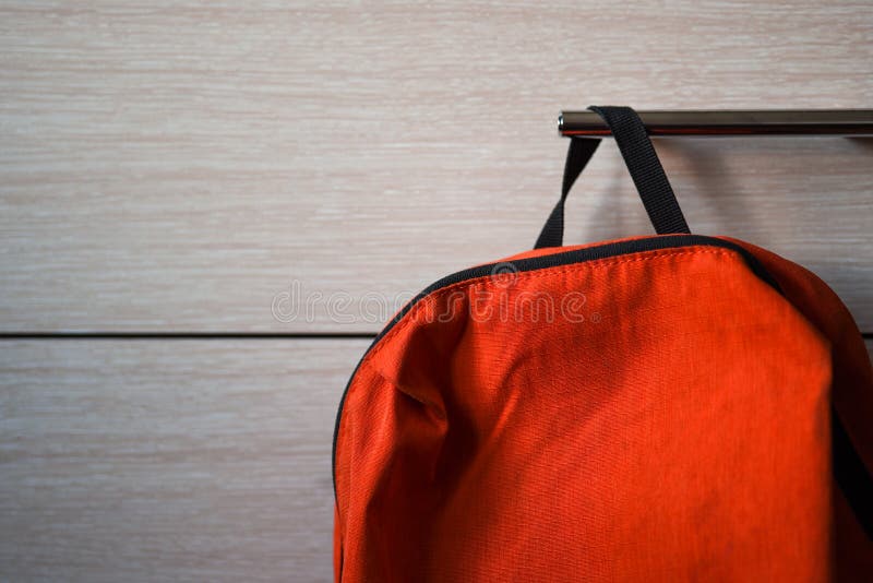 Bright Orange School Backpack Hanging on the Shelf Stock Photo - Image ...