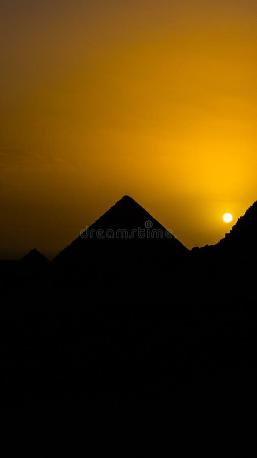 Bright Orange Sunset on the Giza Pyramids in Egypt. Sunset in Cairo ...