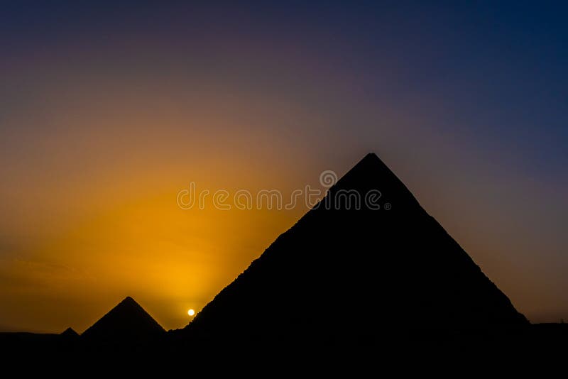 Bright Orange Sunset on the Giza Pyramids in Egypt. Sunset in Cairo ...