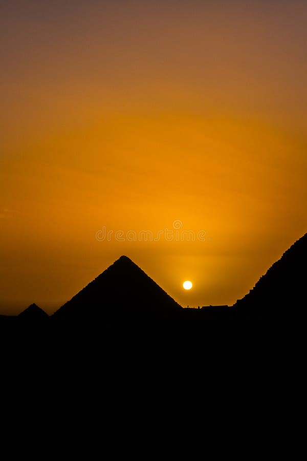 Bright Orange Sunset on the Giza Pyramids in Egypt. Sunset in Cairo ...