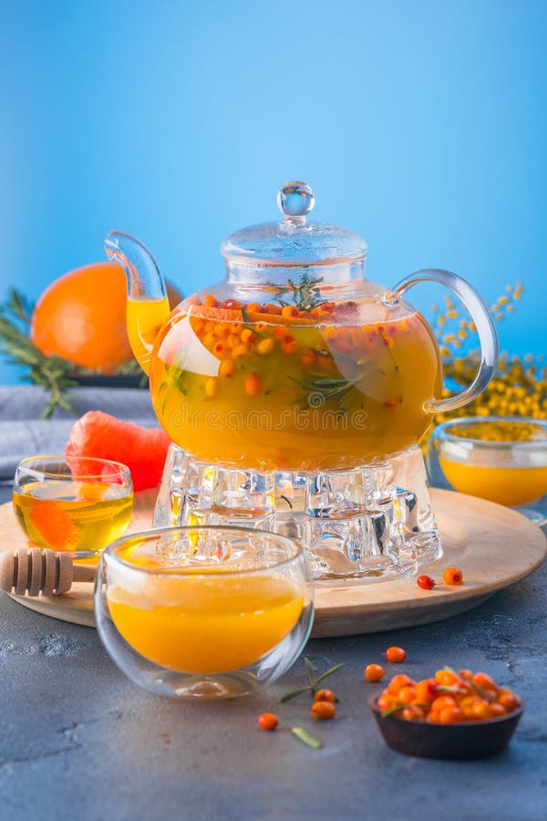 A Bright Orange Teapot on a Blue Background Stock Image - Image of ...