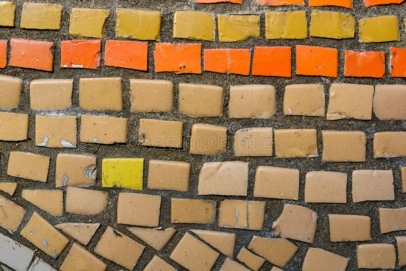 Bright Orange Tile in Stone Wall Stock Image - Image of decoration ...