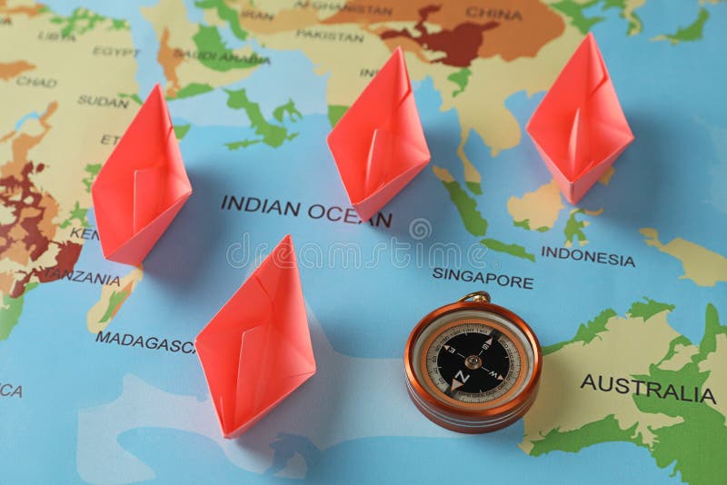 Bright Paper Boats and Compass on World Map, Above View Stock Image ...