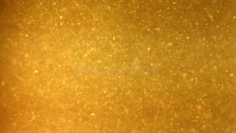 Bright Particles Flowing in Dark Yellow Liquid Stock Video - Video of ...