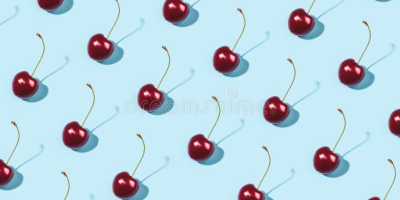 Bright Pattern of Ripe Cherries on a Blue Background. Stock ...