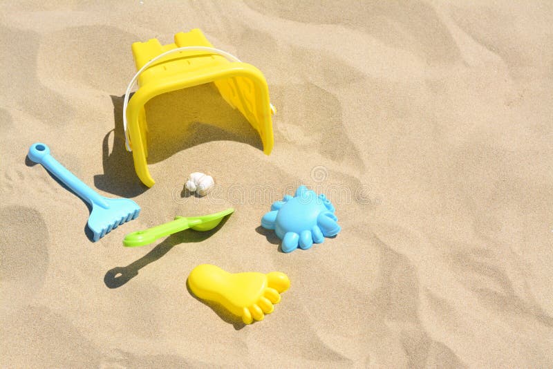 Bright Plastic Bucket, Rake and Shovel on Sand. Beach Toys. Space for ...