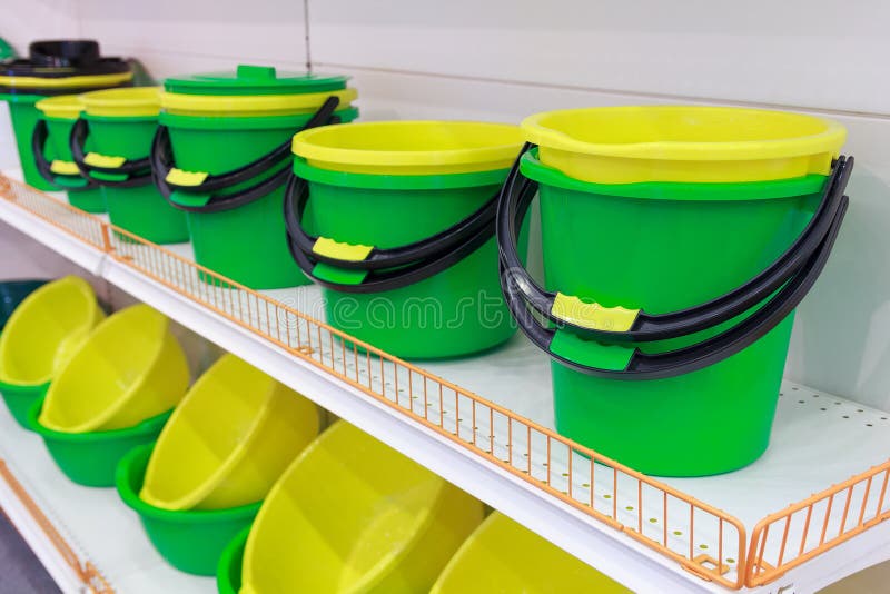 Bright Plastic Buckets and Bowls on the Counter Stock Image - Image of ...