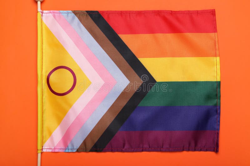 Bright Progress Flag on Orange Background, Top View. LGBT Pride Stock ...