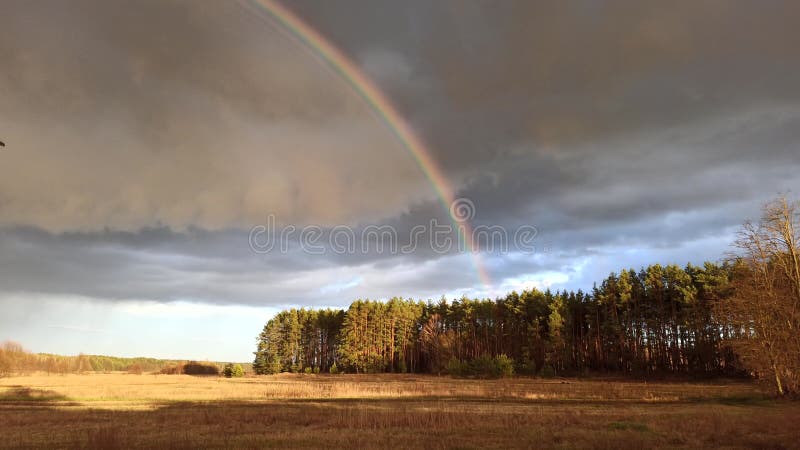 Bright Rainbow in Sky with Clouds. Rainbow after Rain Stock Footage ... Bright Rainbow in Sky with Clouds. Rainbow after Rain Stock Footage ...