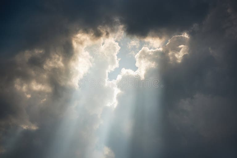 A Bright Ray of Sunshine Breaks through Dark Thunderclouds Stock Image ...