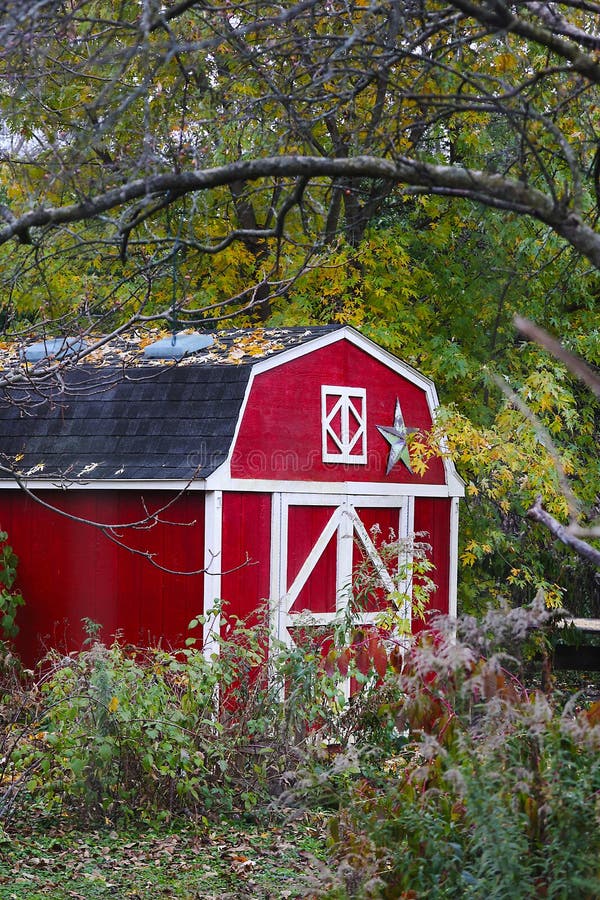 Bright Red Barn Shed Amidst Greenery - Vertical Stock Image - Image of ...