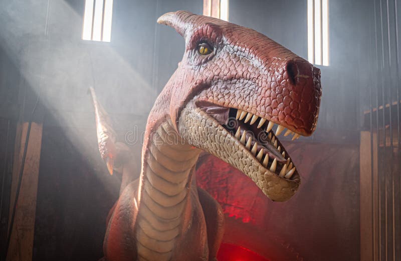 Bright Red Dragon in a Dungeon in England with Rays of Light through ...