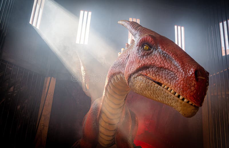 Bright Red Dragon in a Dungeon in England with Rays of Light through ...