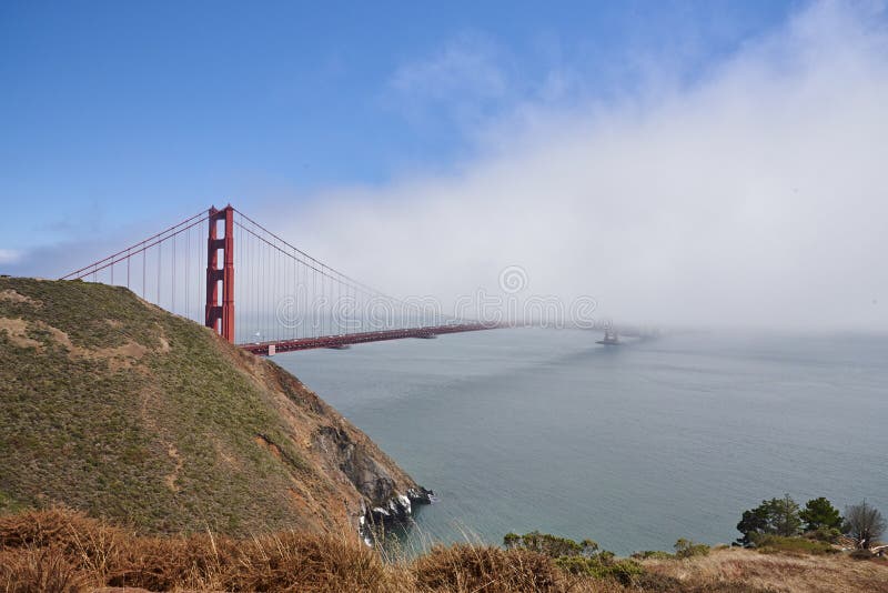 Bright Red Golden Gate Bridge Half Covered in Mist Stock Photo - Image ...