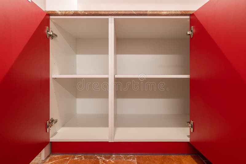 Bright Red Open Cupboard with Empty White Shelves and a Terracotta ...