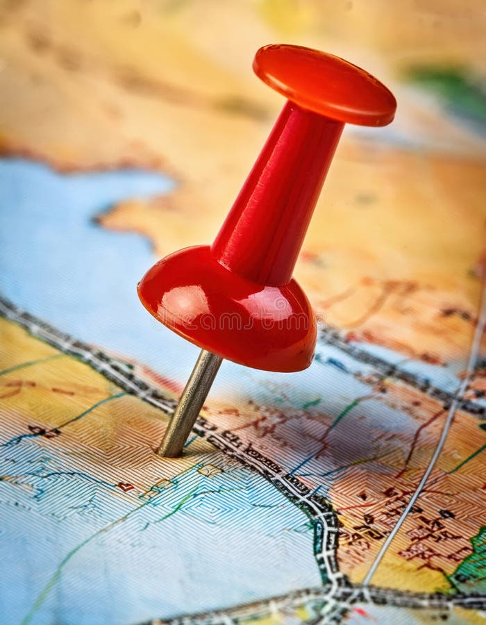 Exploring New Destinations with a Push Pin on a Detailed Map Stock ...