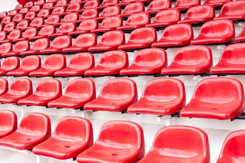 Bright red stadium seats stock image. Image of public - 26471617