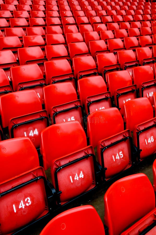 Bright red stadium seats stock photo. Image of conference - 6865264