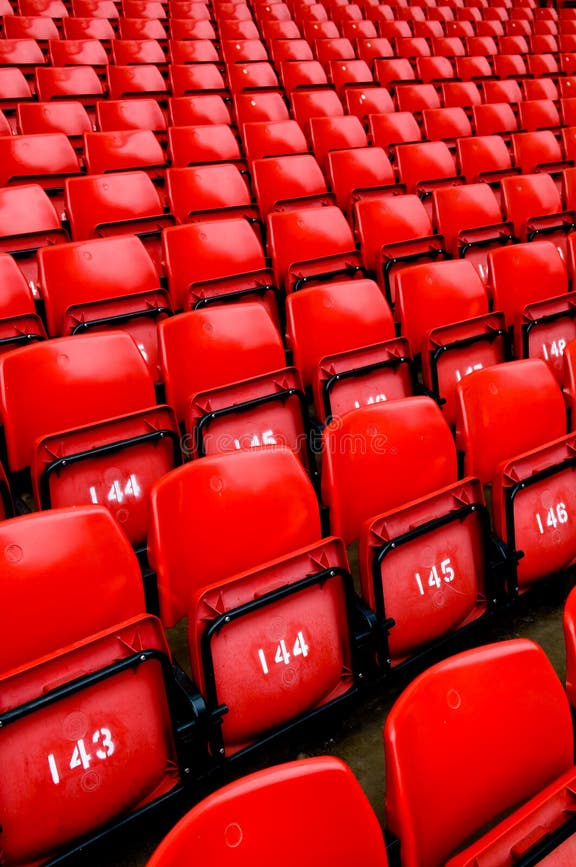 Bright red stadium seats stock photo. Image of conference - 6865264