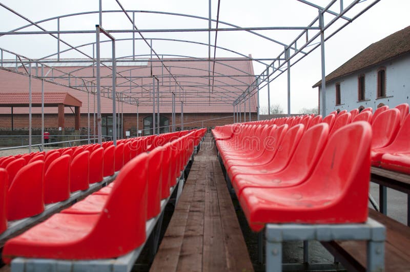 Bright red stadium seats stock image. Image of number - 49547967