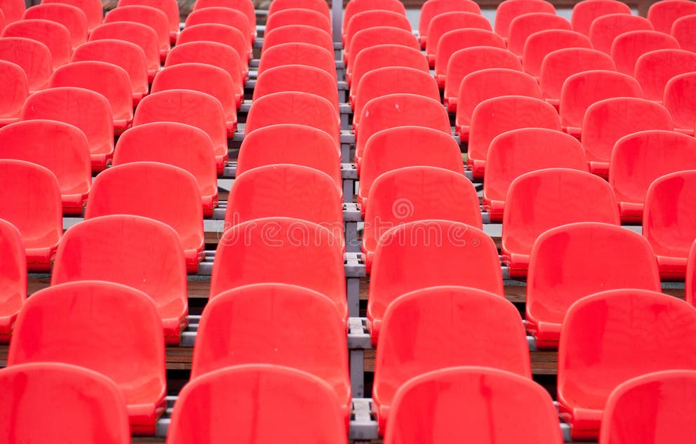 Bright red stadium seats stock image. Image of pattern - 50049453